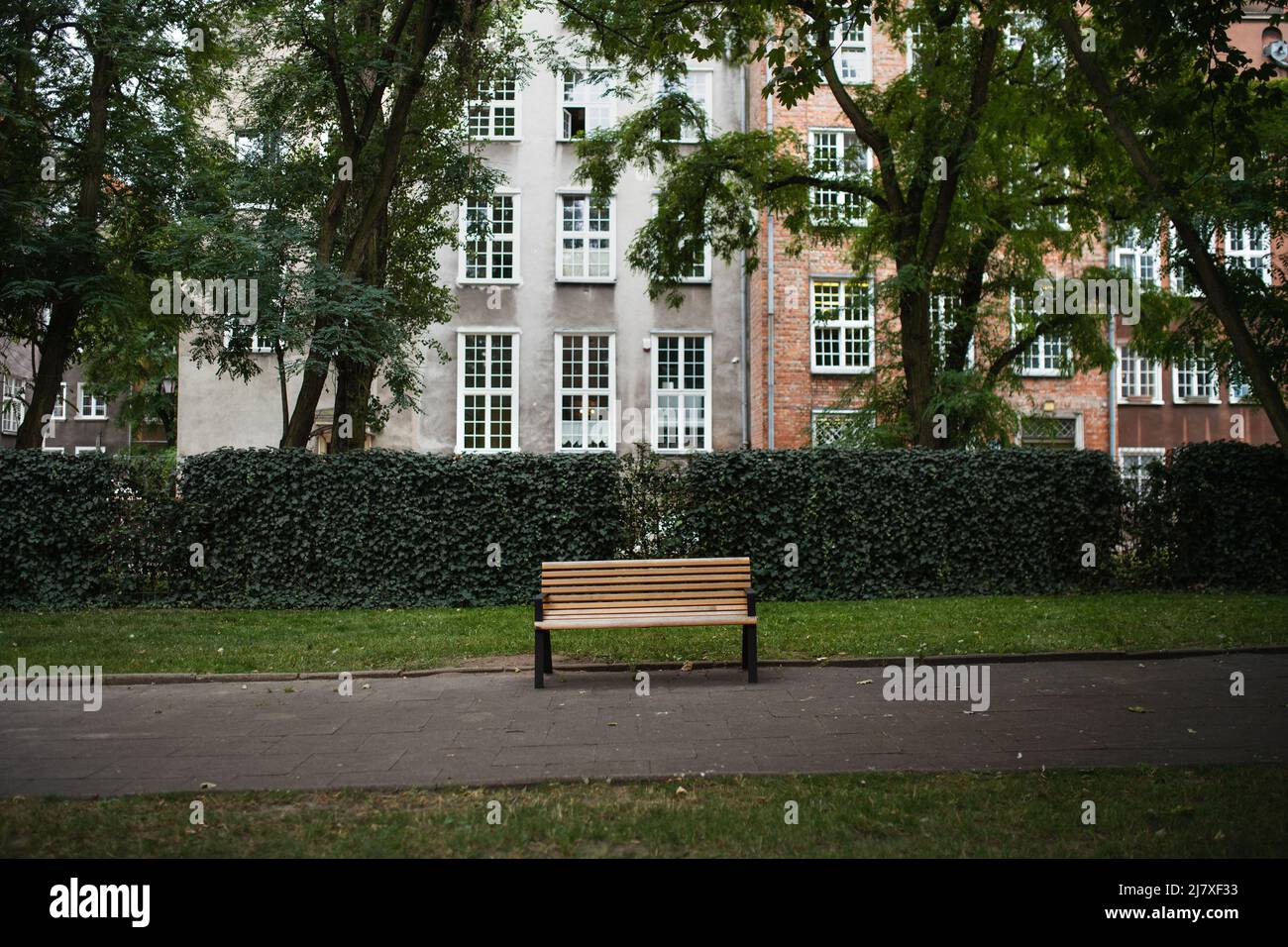 Empty bench in town hi-res stock photography and images - Alamy