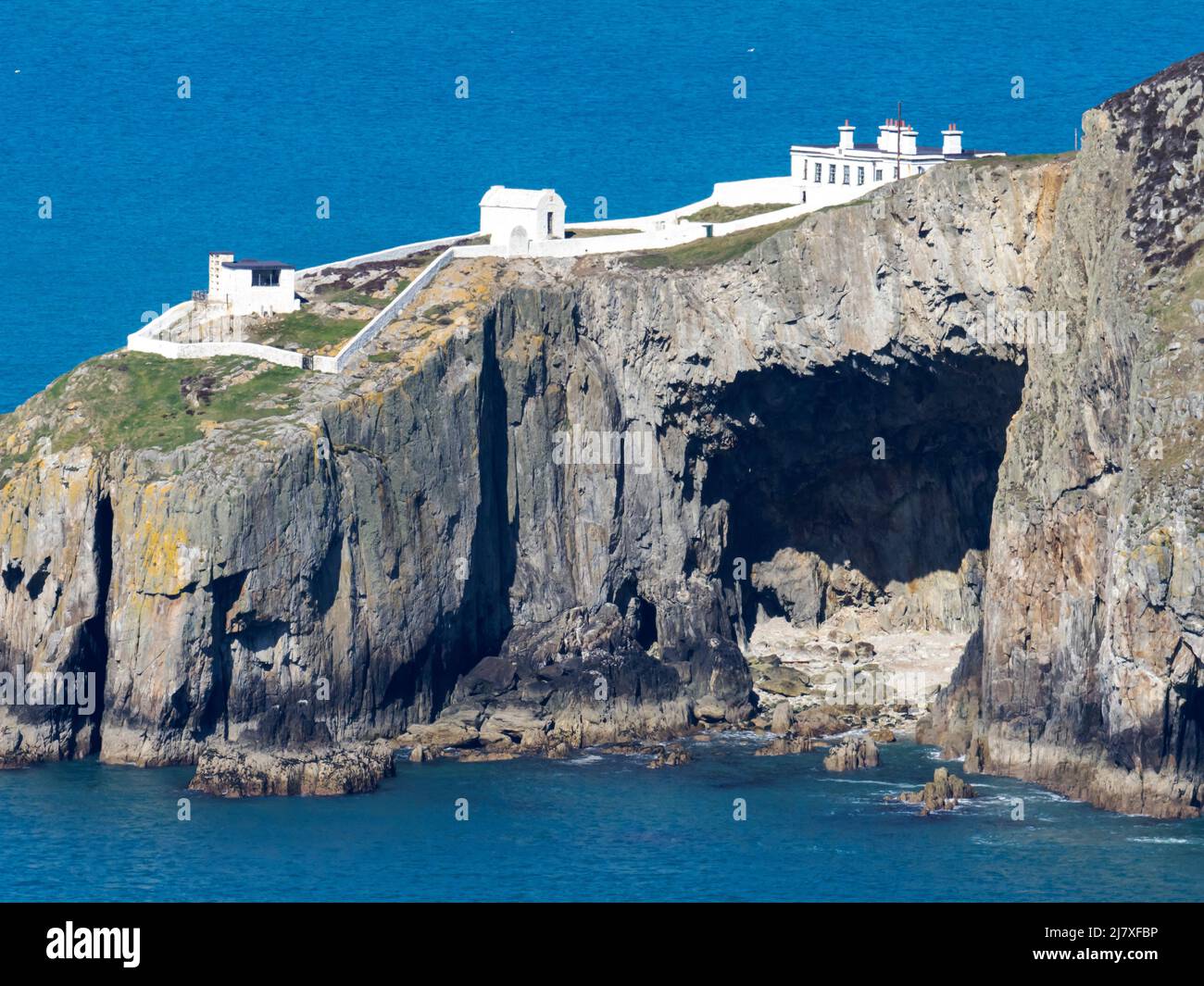 A signal station on North Stack, Anglesey, Wales, UK with the Skerries ...