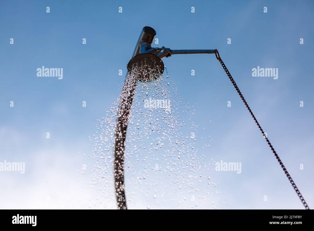 Water flows from the shower . Splashing drops of outdoor shower Stock ...