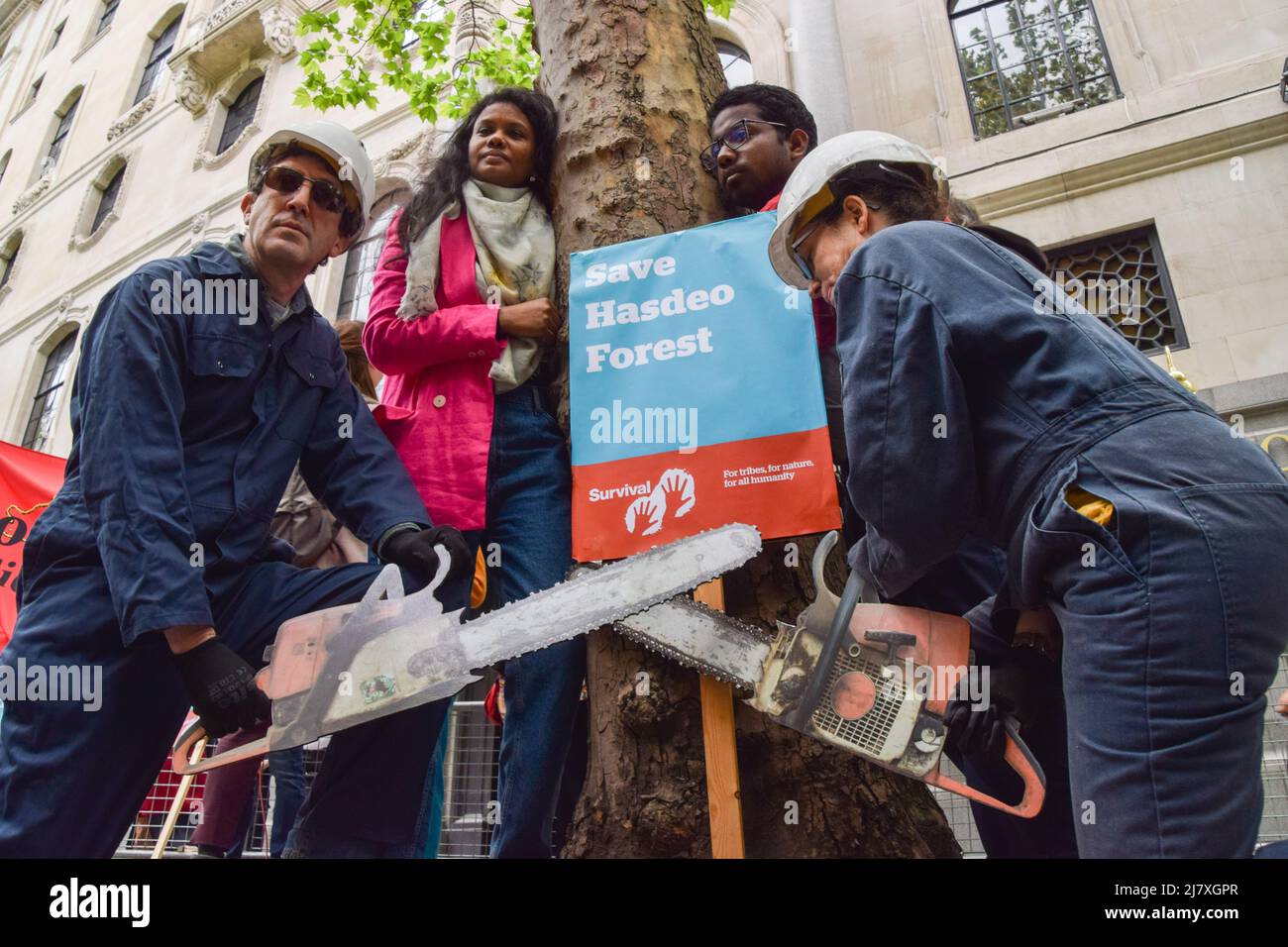 London, England, UK. 11th May, 2022. Protesters with mock chainsaws ...