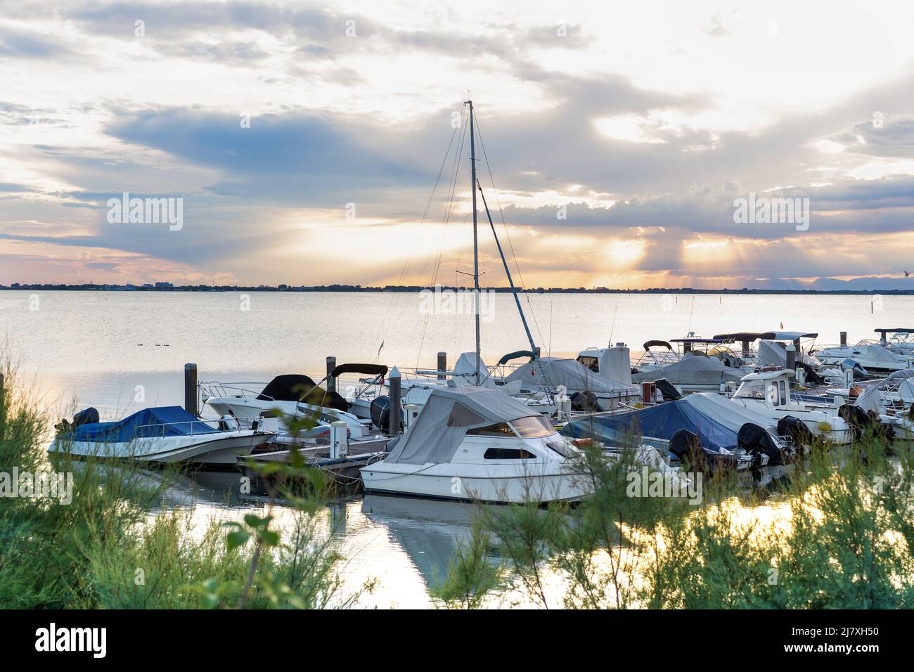 Beautiful and peaceful evening with sunset over the small sea harbour ...