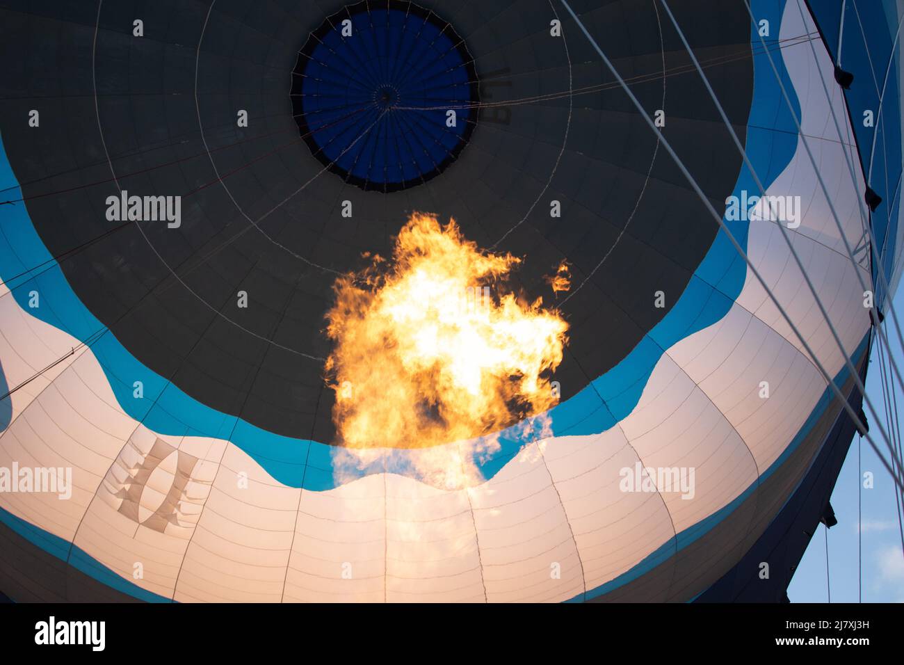 Flame from gas burner inflating hot air balloon Stock Photo - Alamy