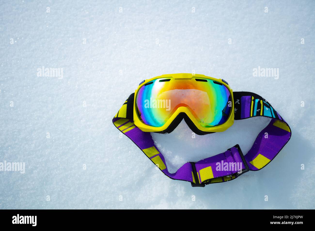 Yellow ski mask in snow from above - alpine vacation concept Stock ...