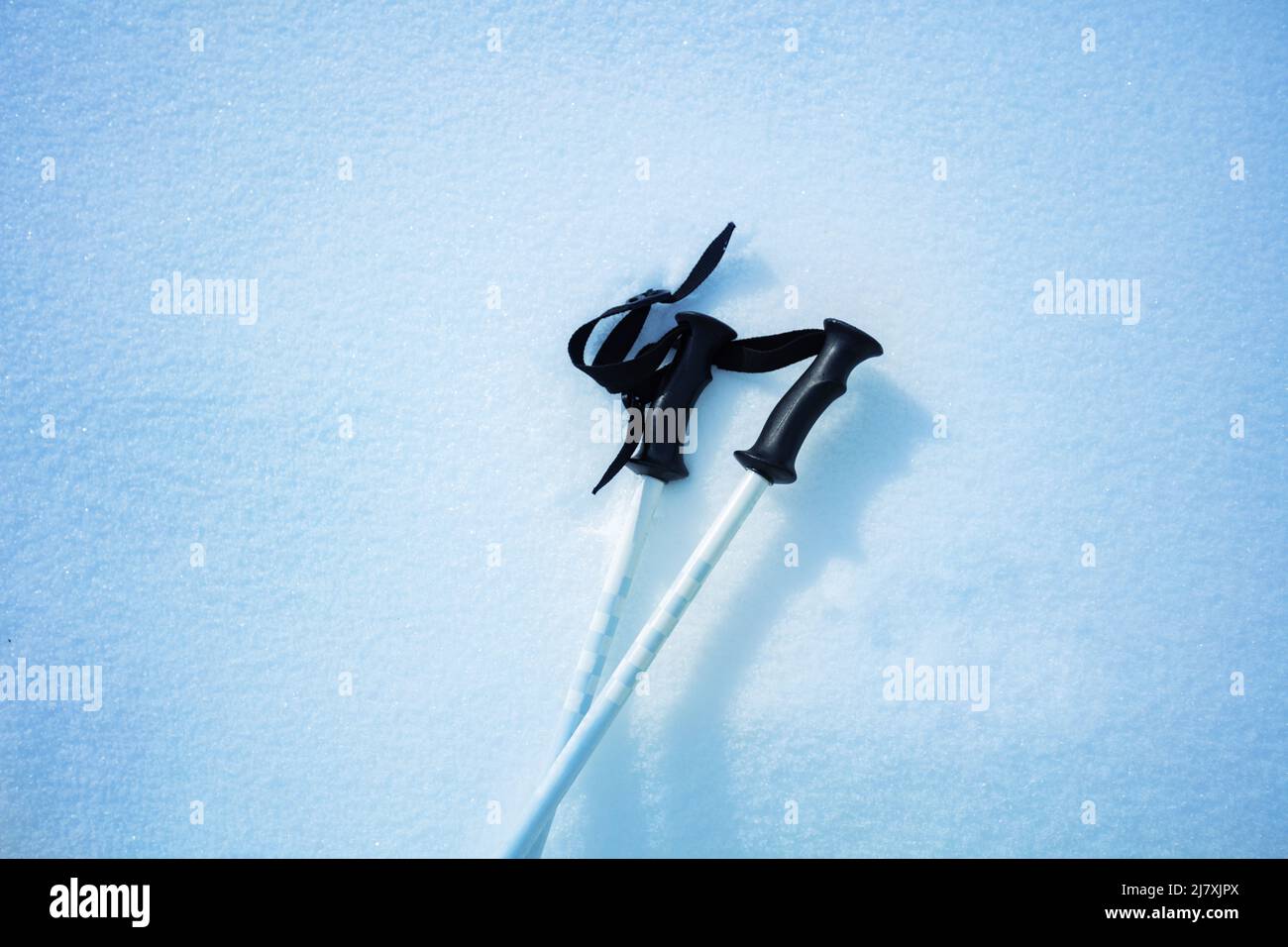 Mountain ski poles pair in the snow from above close-up image Stock ...