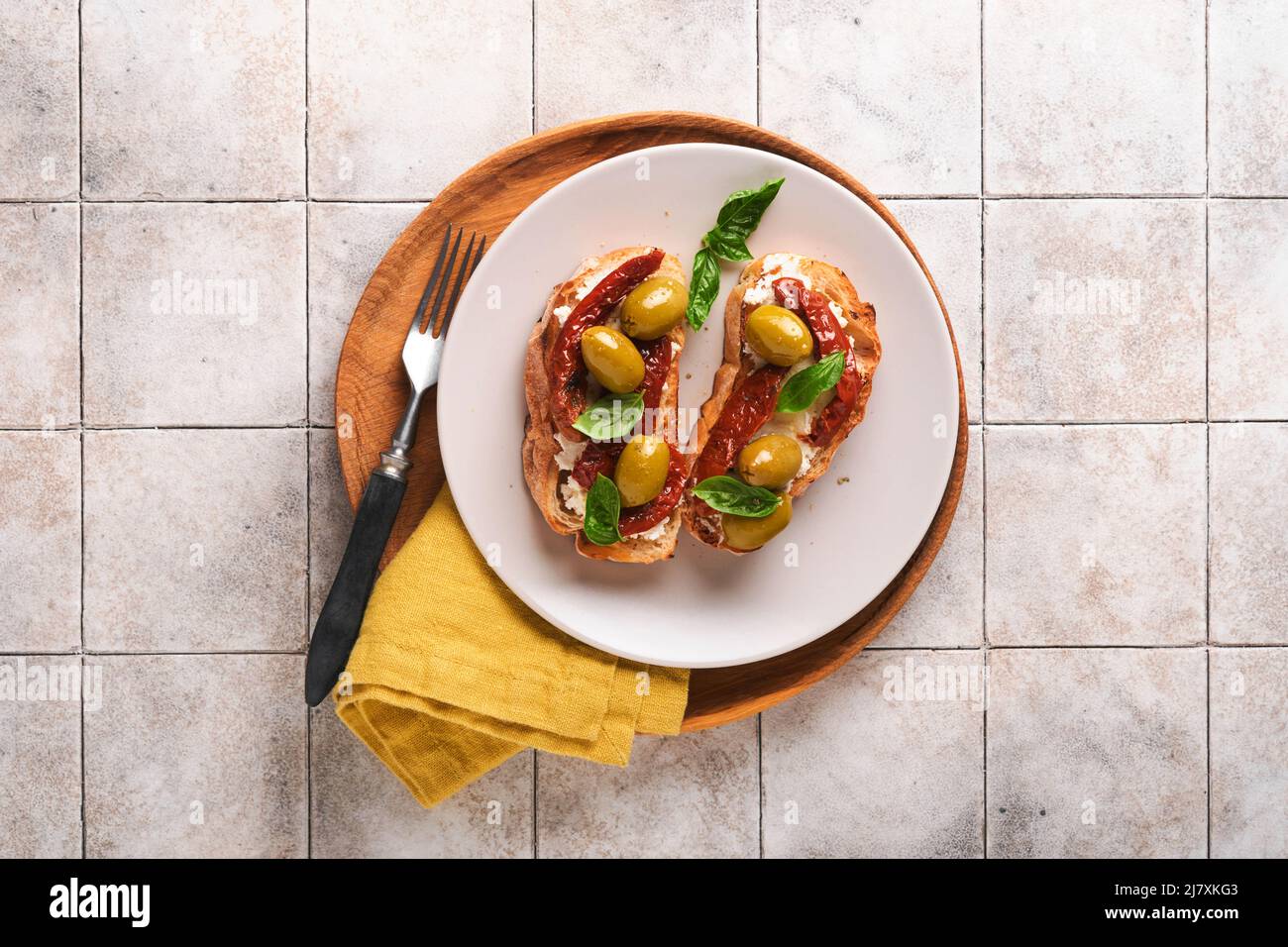 Bruschetta with sun dried tomatoes. Toast or sandwich with ricotta, sun ...