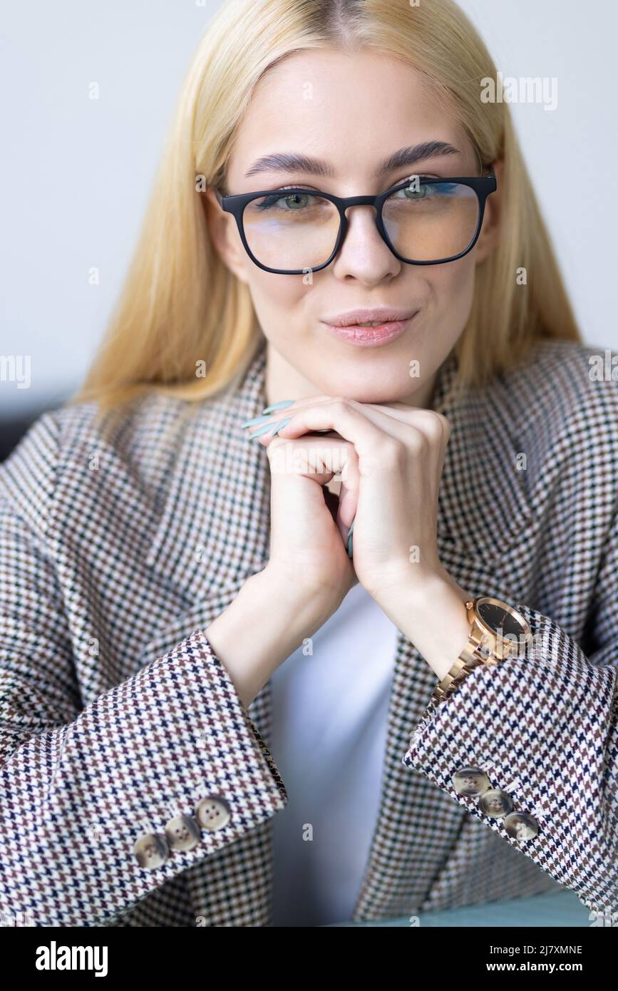 Business women write on notepad with pen to calculate financial ...