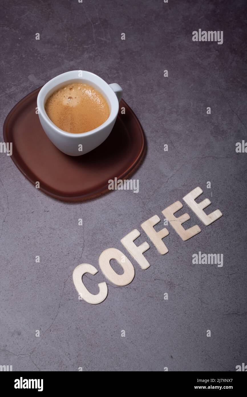 Espresso coffee text word with coffee served on a white cup on a ...