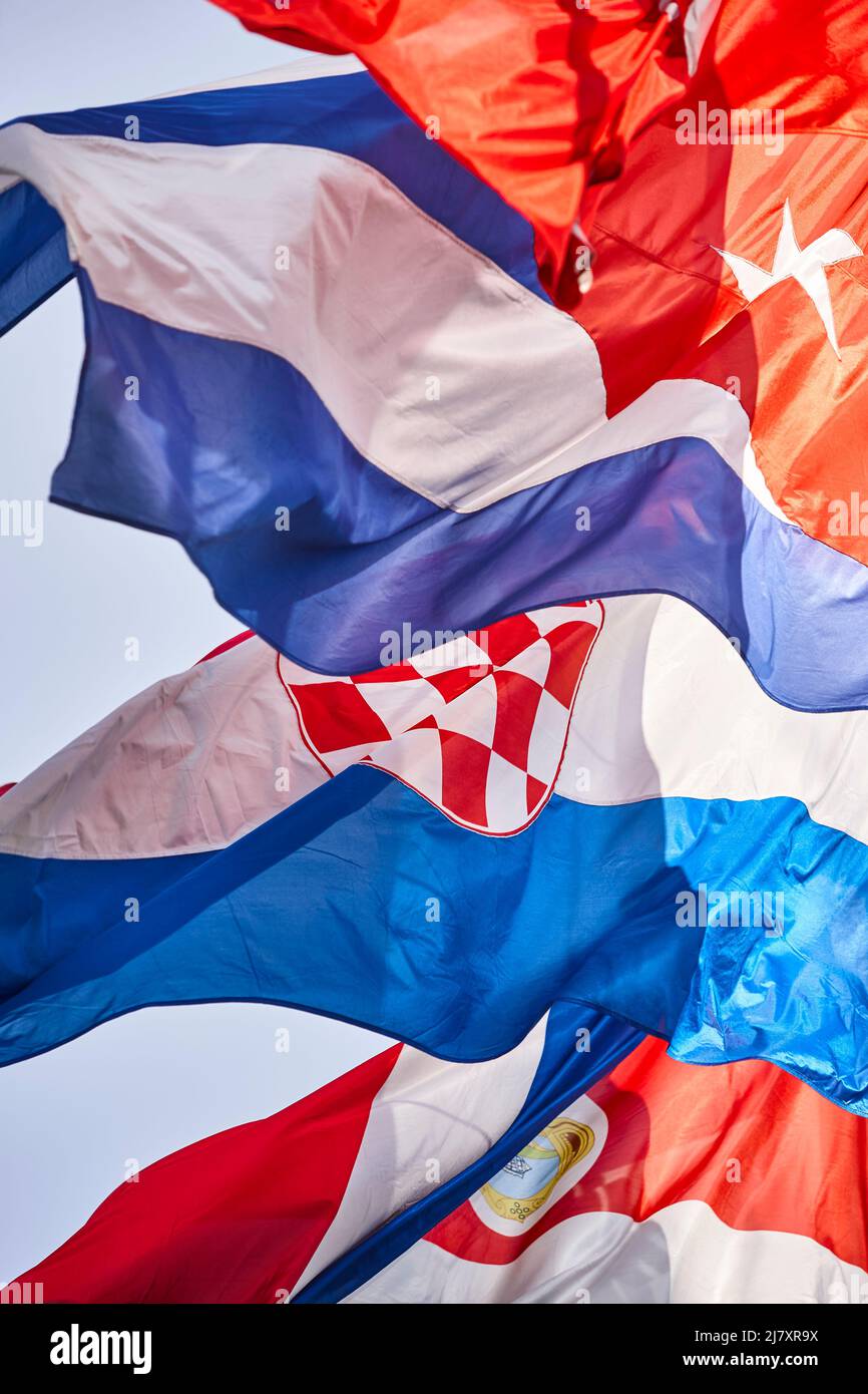 Flags of the word waving in the wind. Nation emblems Stock Photo - Alamy