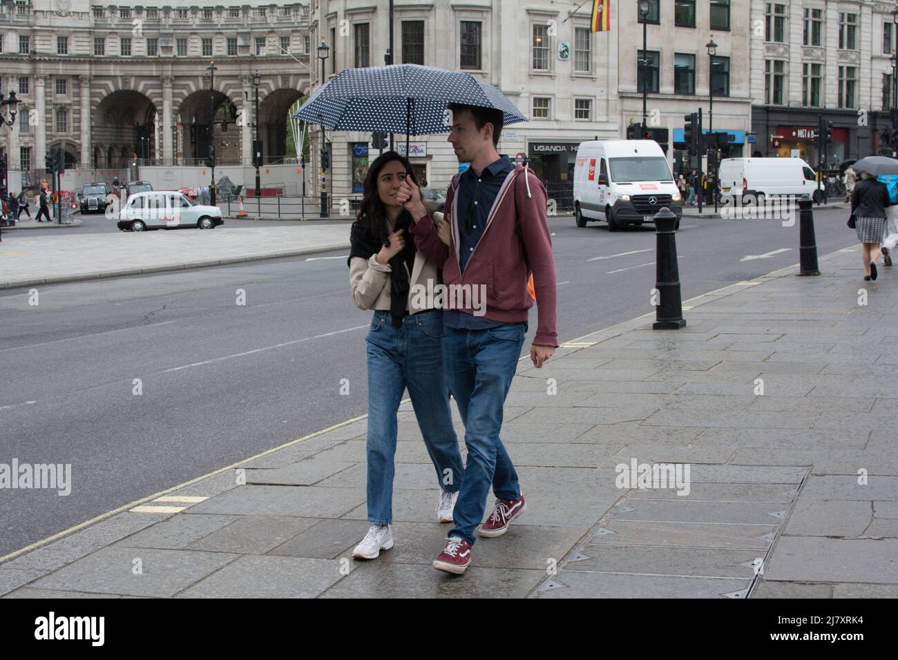 Woman wearing plastic raincoat hi-res stock photography and images - Alamy