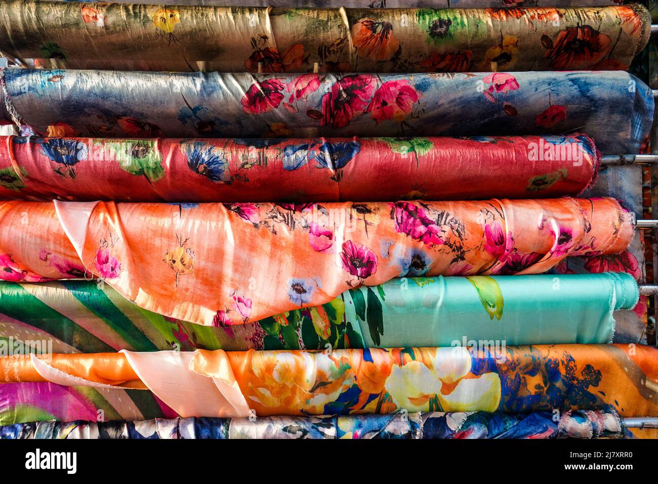 Colorful fabric rolls at a Vietnamese fabric market Stock Photo - Alamy