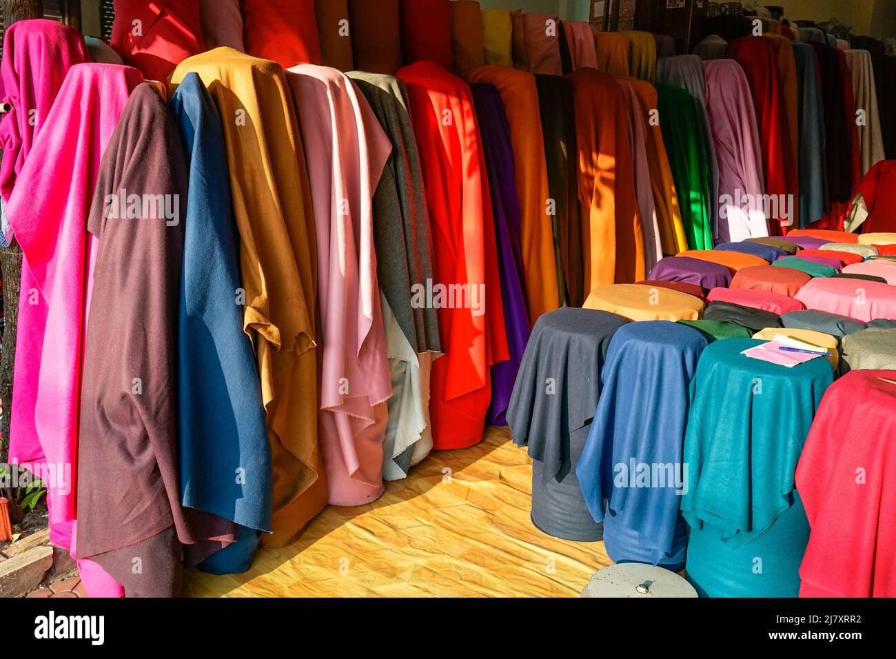 Colorful fabric rolls at a Vietnamese fabric market Stock Photo - Alamy