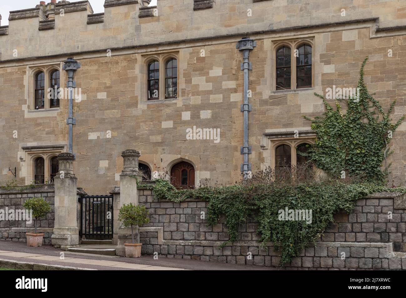 House with arched windows made of honey coloured stone based in the ...