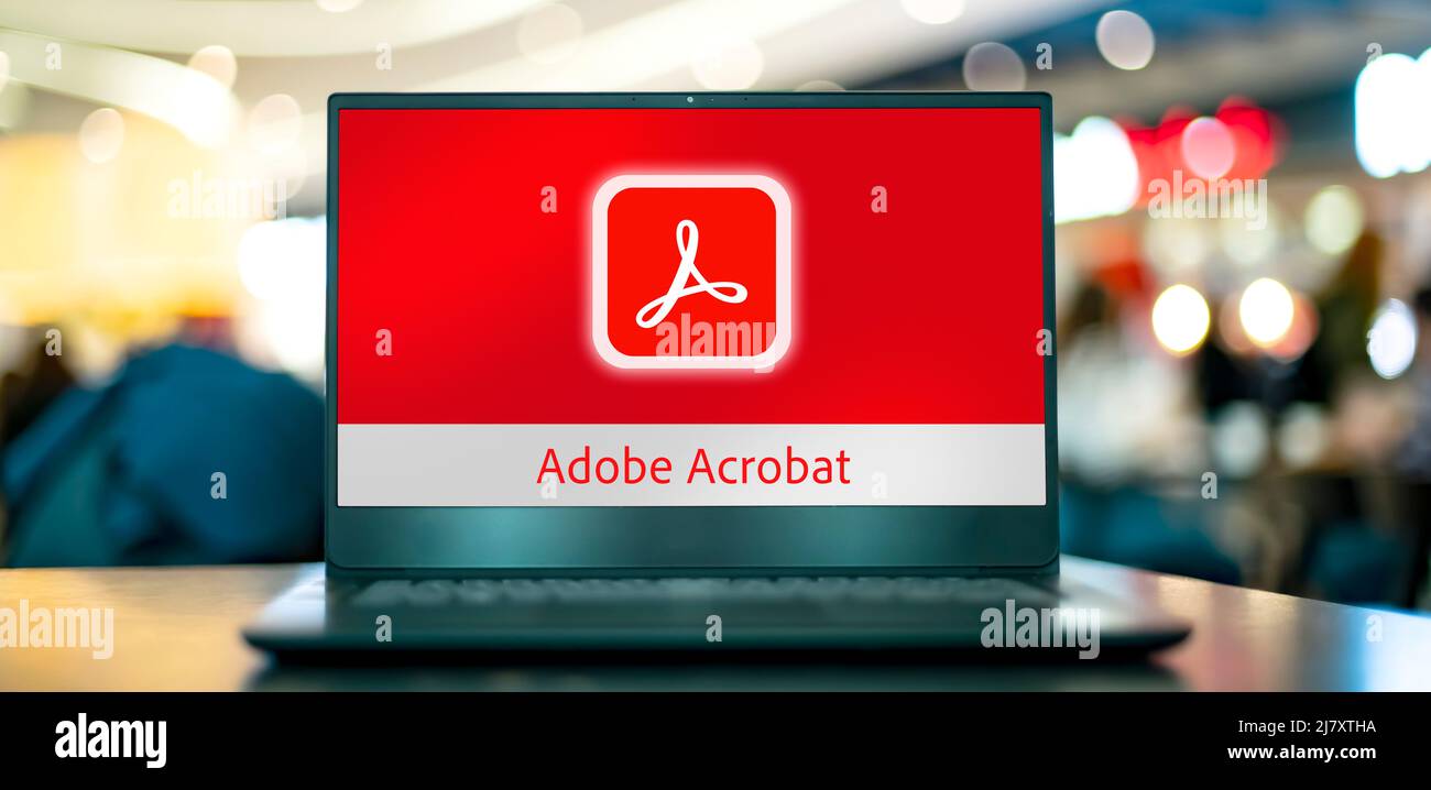 POZNAN, POL - JAN 16, 2022: Laptop computer displaying logo of Adobe ...