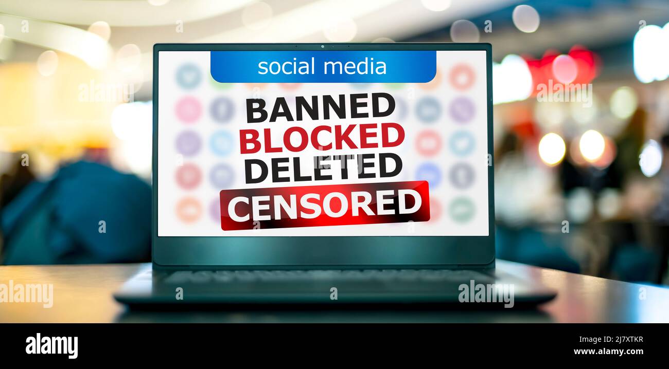 Laptop computer with the sign warning against censorship in social ...