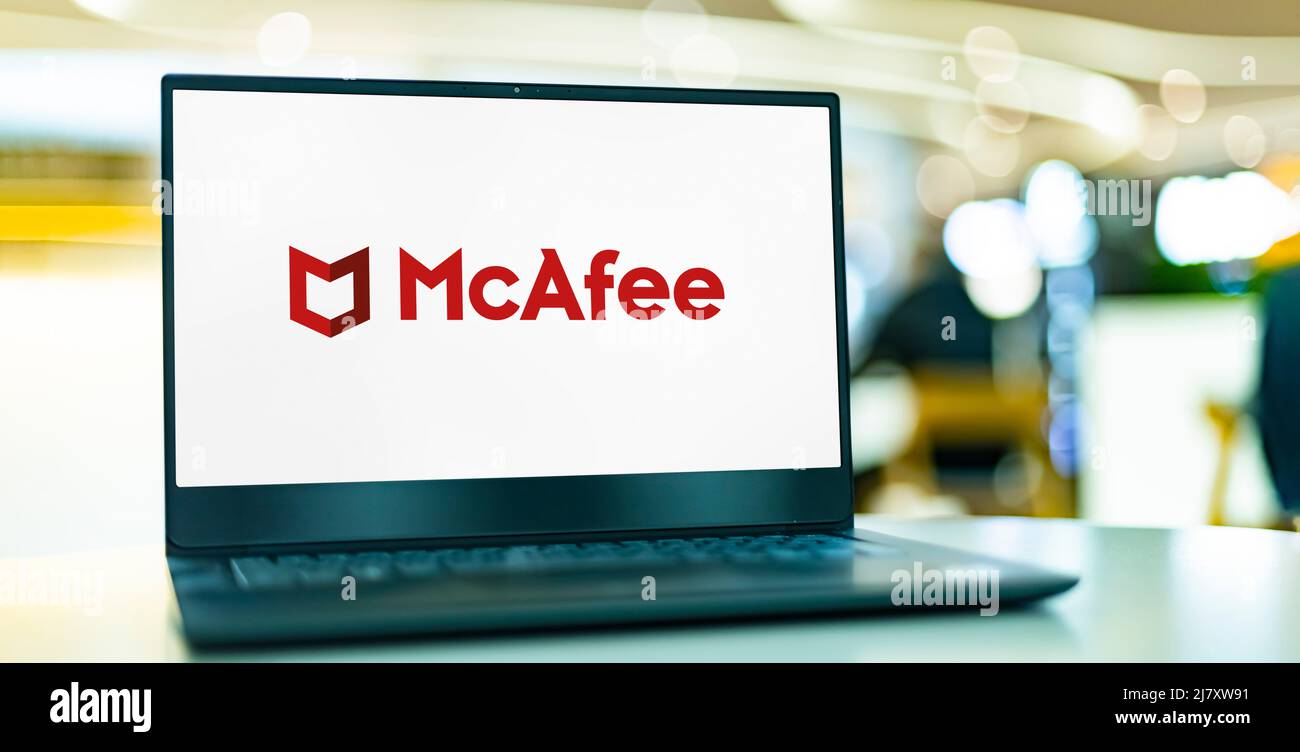 POZNAN, POL - APR 7, 2022: Laptop computer displaying logo of McAfee, a ...