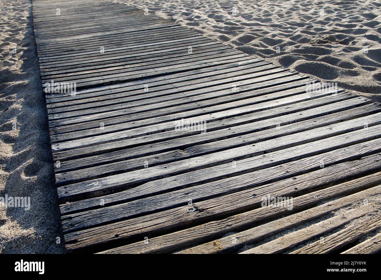 Wooden walkway on the sandy beach Stock Photo - Alamy