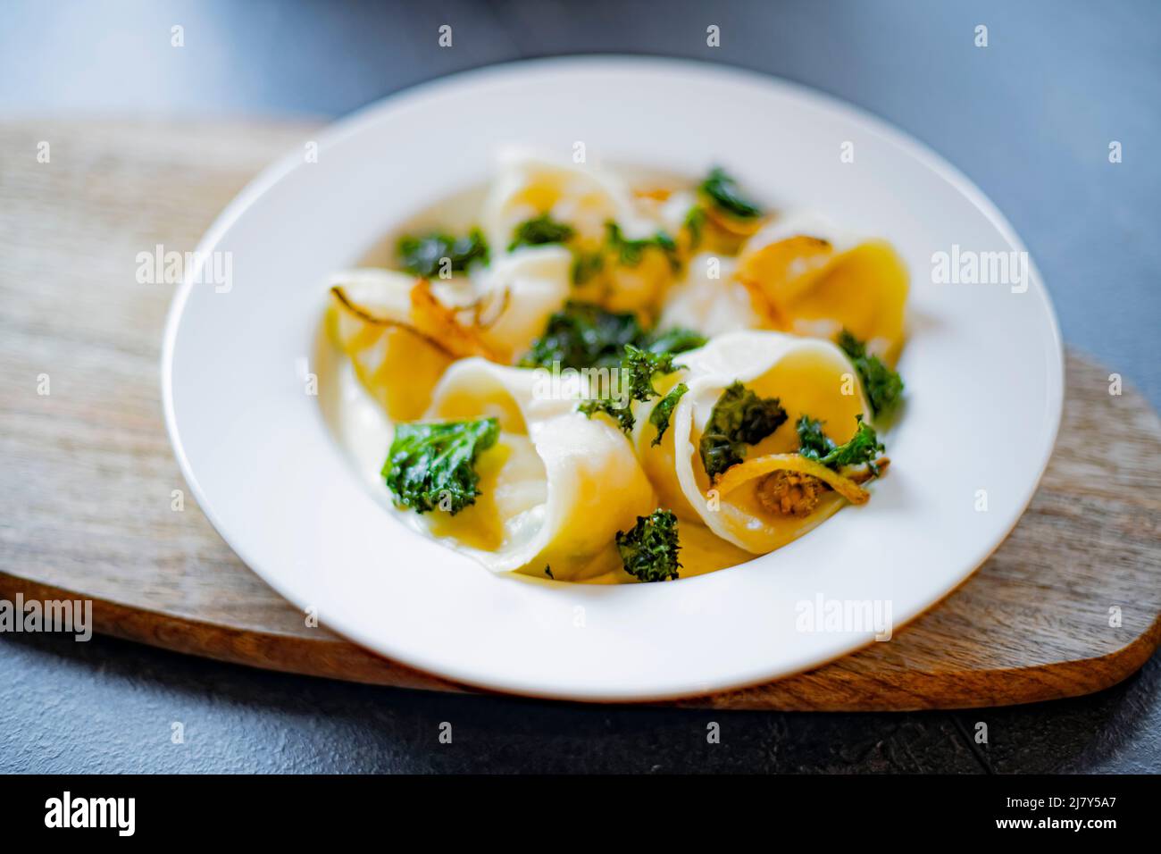 A plate of traditional East European dumplings, Pierogi Stock Photo - Alamy