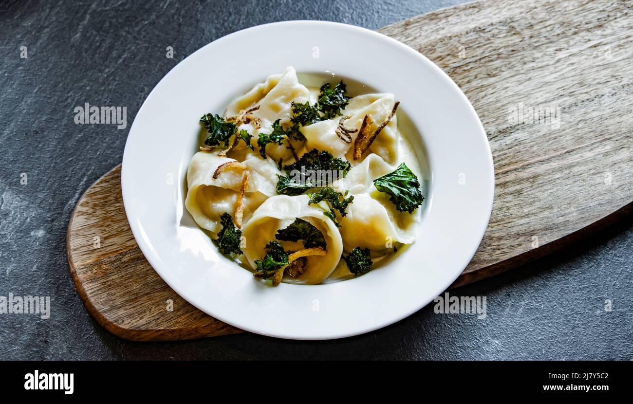 A plate of traditional East European dumplings, Pierogi Stock Photo - Alamy