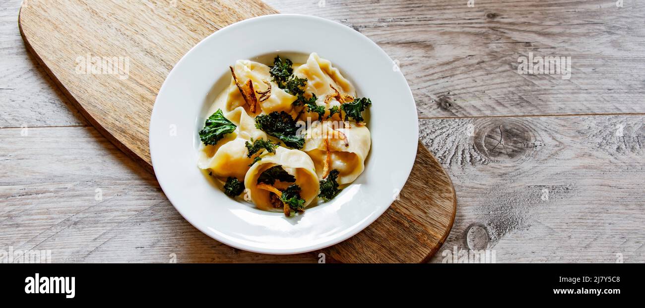 A plate of traditional East European dumplings, Pierogi Stock Photo - Alamy