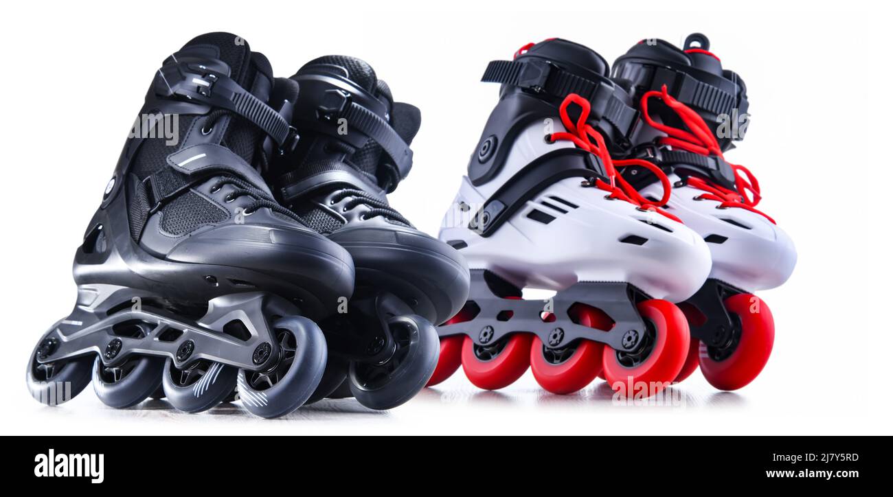 Two pairs of inline skates isolated on white background Stock Photo - Alamy