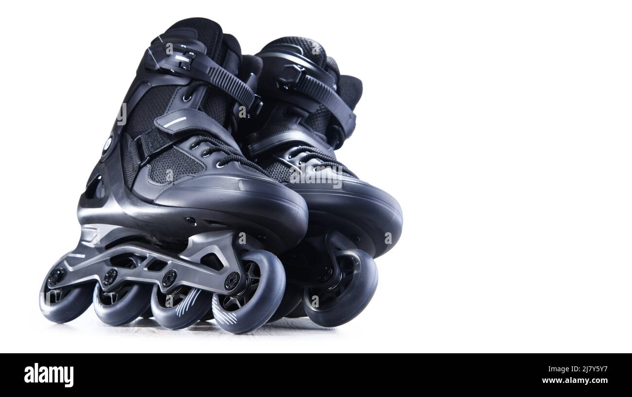 A pair of black inline skates isolated on white background Stock Photo ...