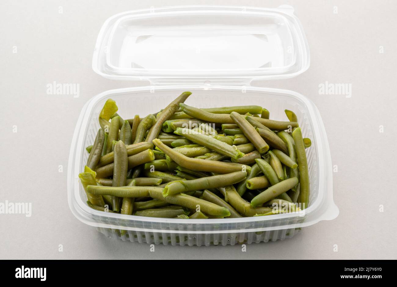 Boiled green beans in transparent food-grade plastic box for ...