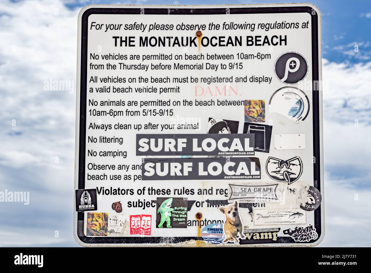 stickers and marks random placed on Ditch Plains Signs Stock Photo - Alamy