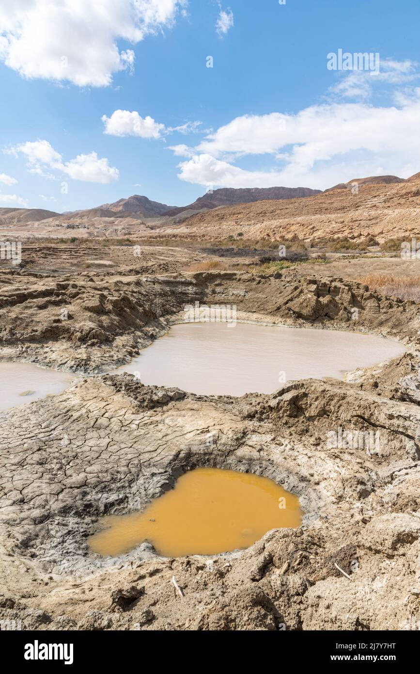 Sinkhole filled with turquoise water, near Dead Sea coastline. Hole ...