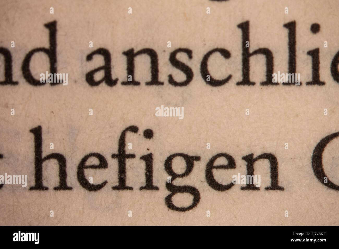Text printed on old cheap paper under the microscope Stock Photo - Alamy