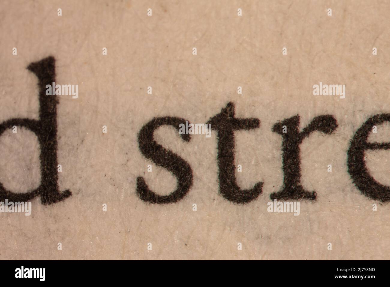 Text printed on old cheap paper under the microscope Stock Photo - Alamy