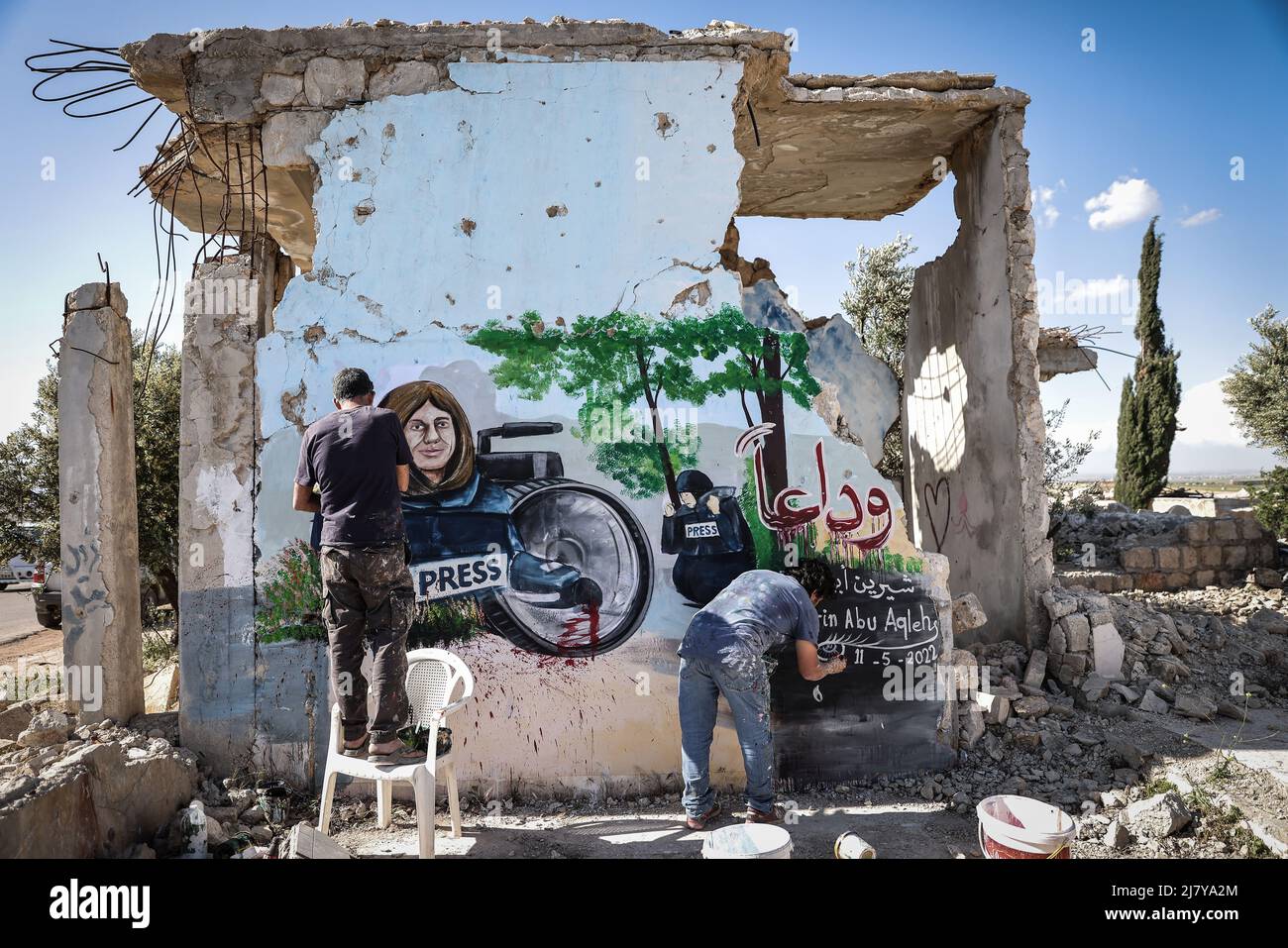 11 May 2022, Syria, Binnish: Syrian artists paint a mural in solidarity ...