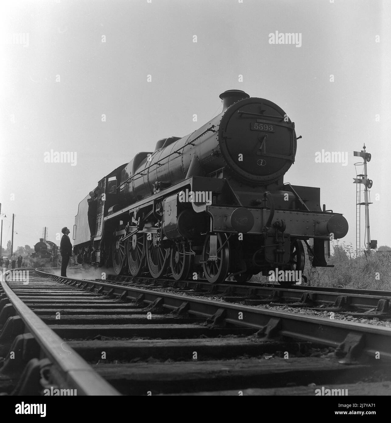 1969, historical, man on track talking to the drivers of the waiting ...