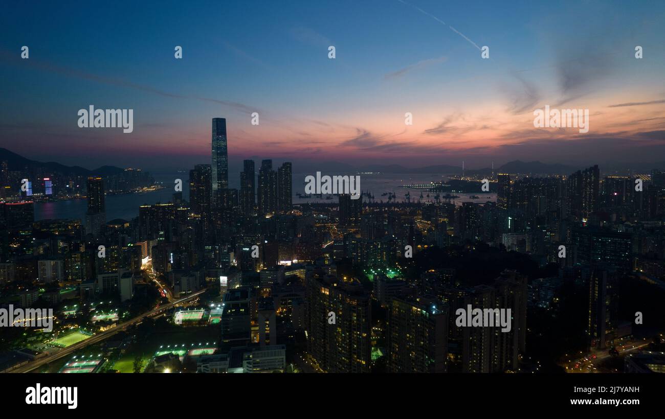 cityscape of Kowloon in Hong Kong, with the after glow of sky on the ...
