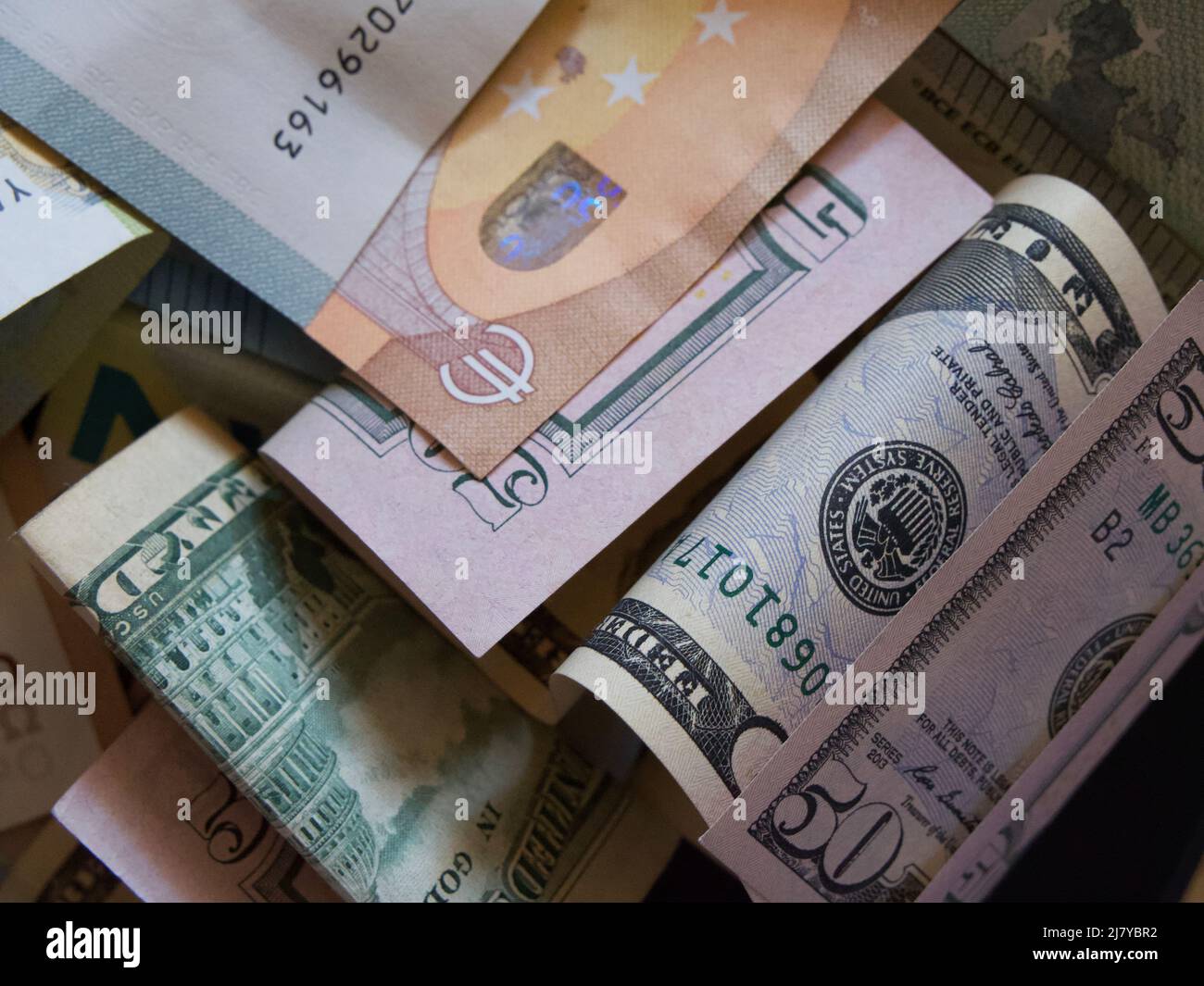 Cash banknotes dollars and euros are mixed up, a close-up shot Stock ...