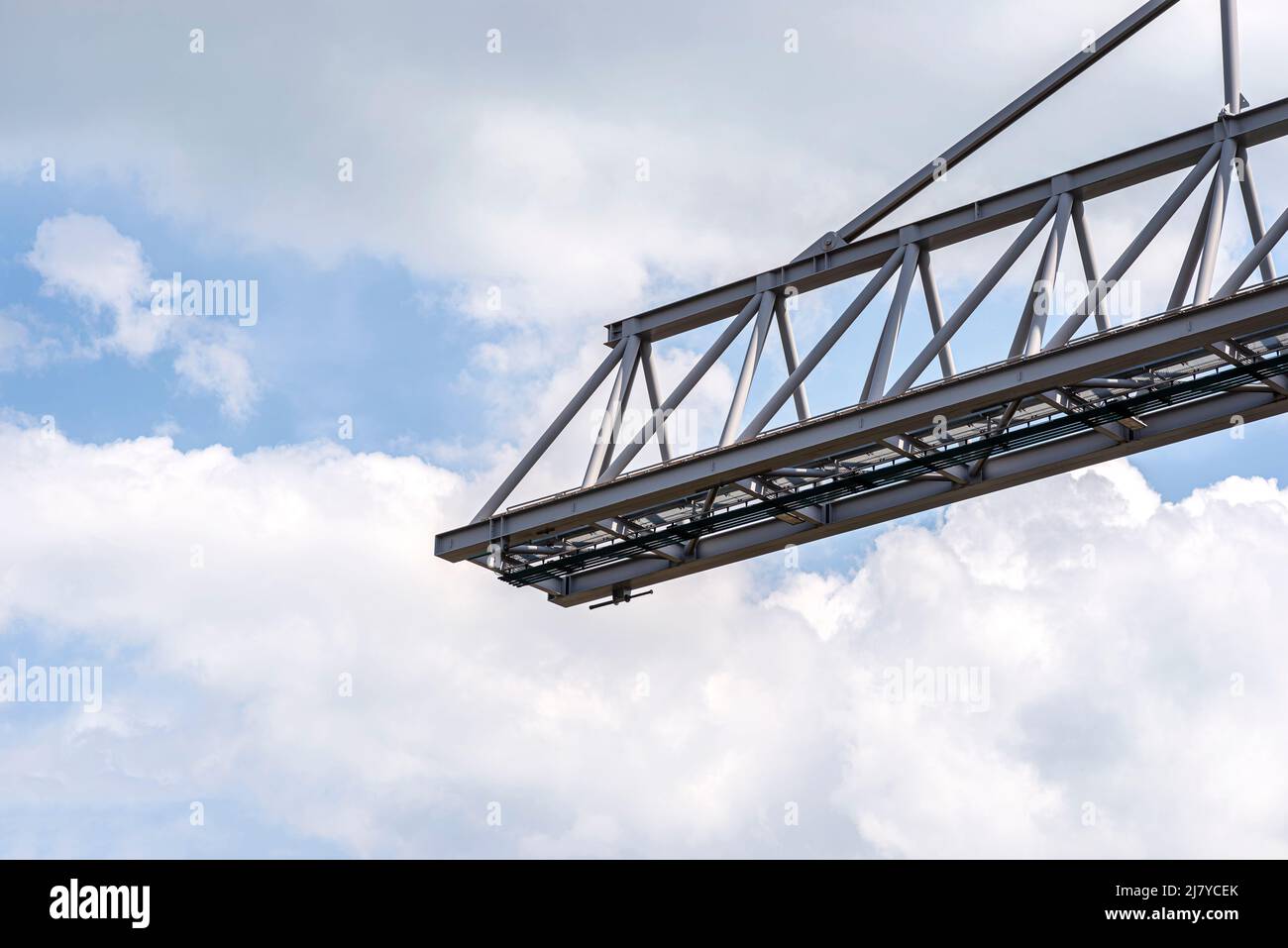 The end of the truss of a container crane on rails on the banks of the ...