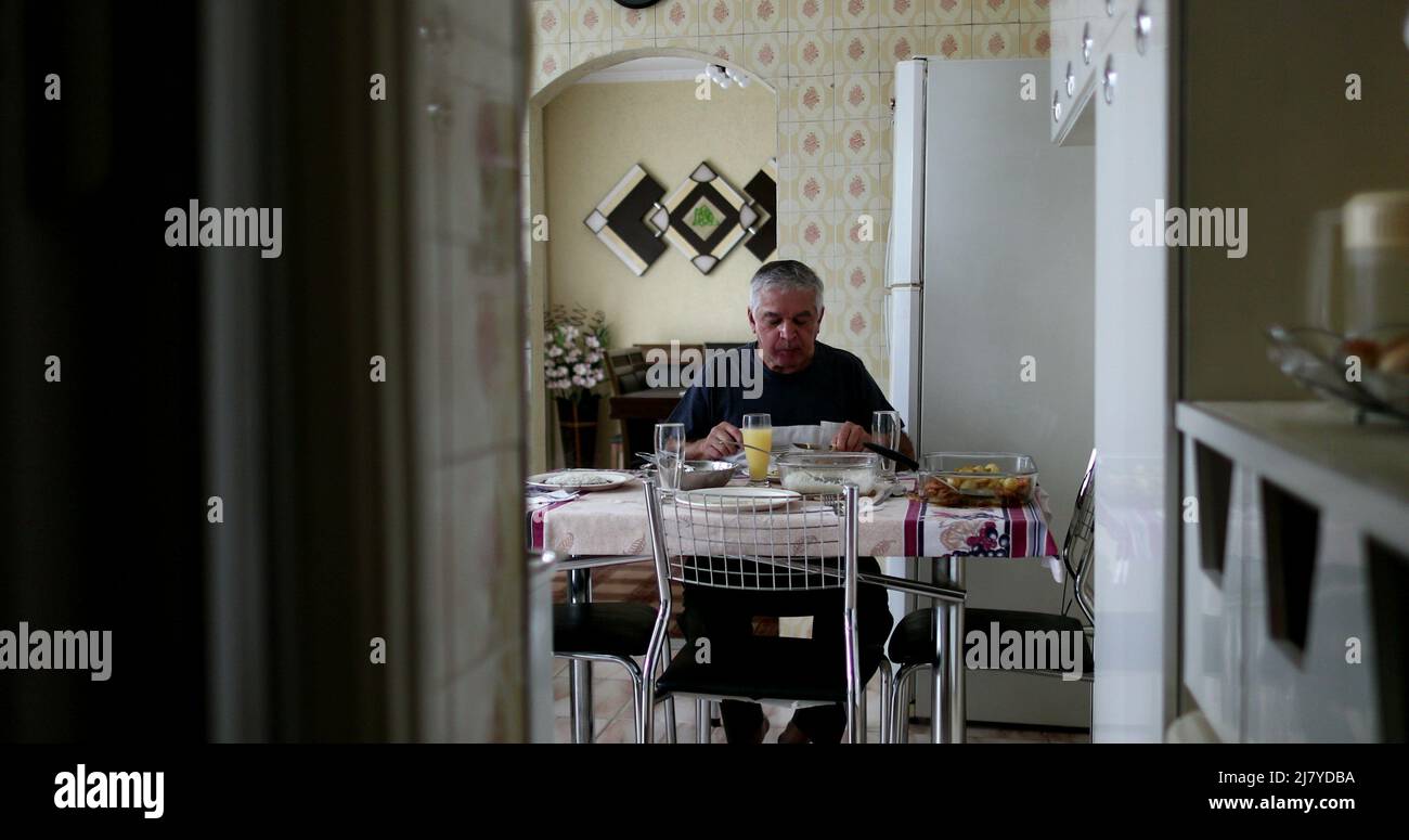 Old man eating dinner alone home hi-res stock photography and images ...