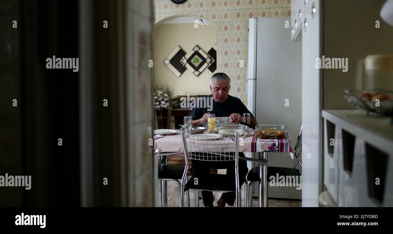 Old man eating dinner alone hi-res stock photography and images - Alamy