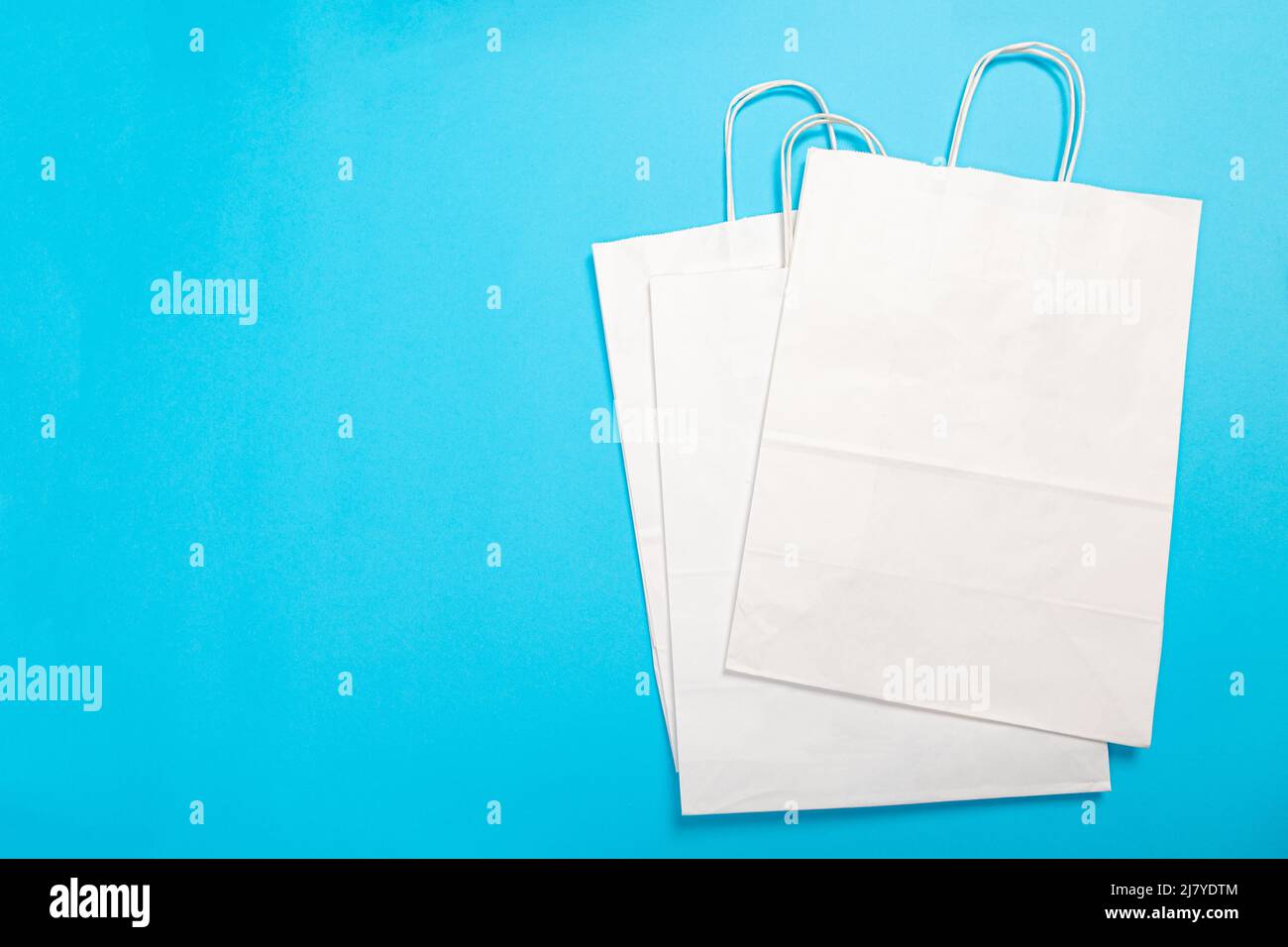 eco blank white paper carry bag with shopping handles facing forward on ...