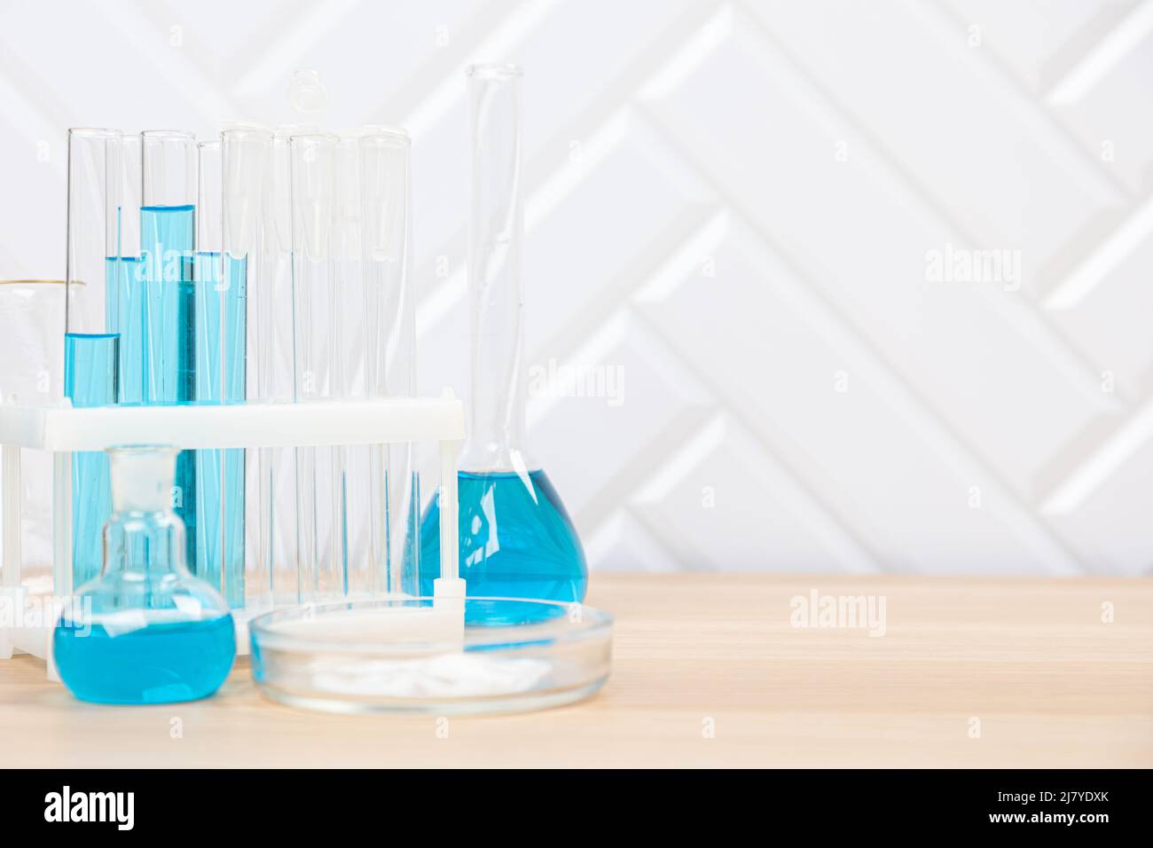 Laboratory glassware with test tubes. flasks, dropper, petri dishes ...