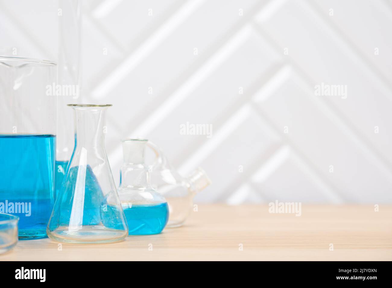 Laboratory glassware with test tubes. flasks, dropper, petri dishes ...
