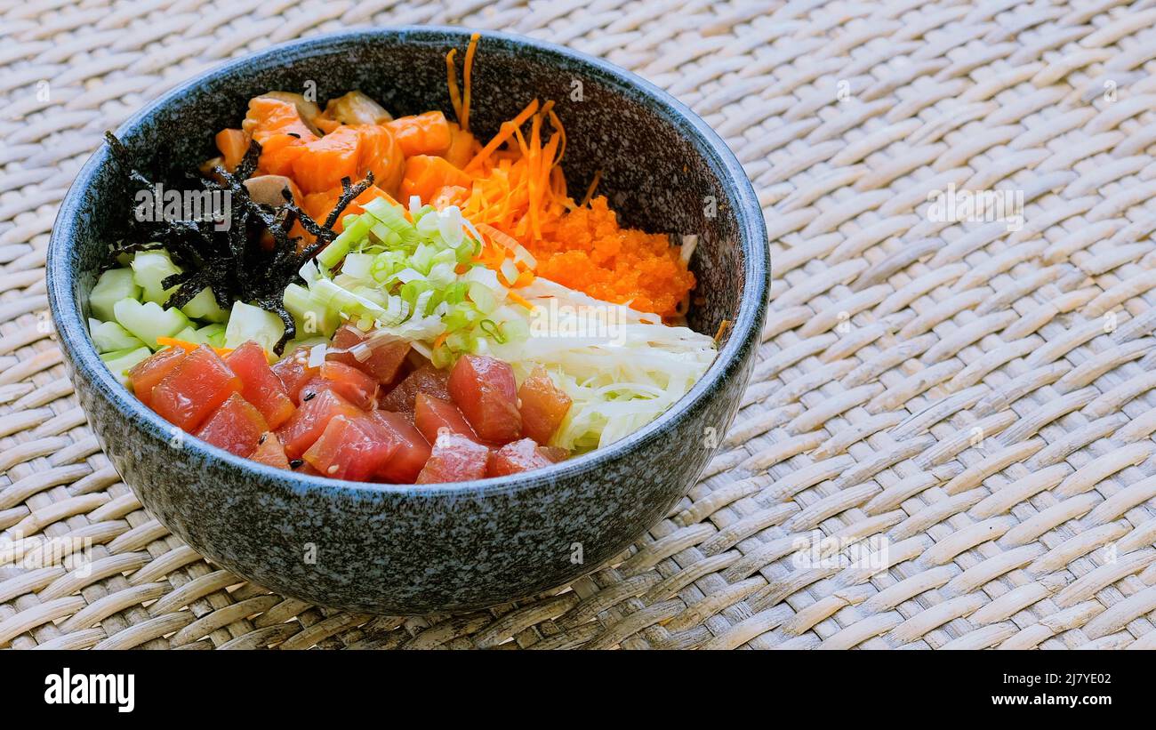 Healthy eating, clean food concept. Fish, vegetables, seaweed in poke ...