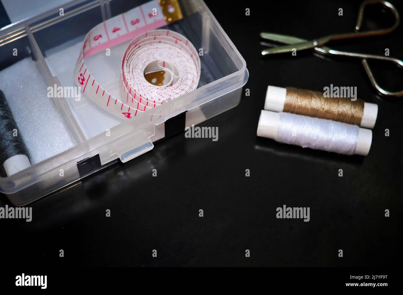 Equipment for sewing scissors tap measure and threads Stock Photo - Alamy