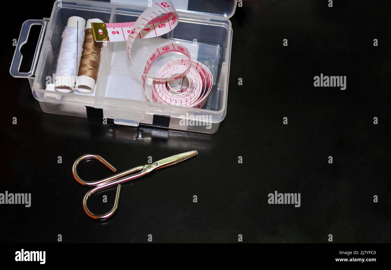 Equipment for sewing scissors tap measure and threads Stock Photo - Alamy