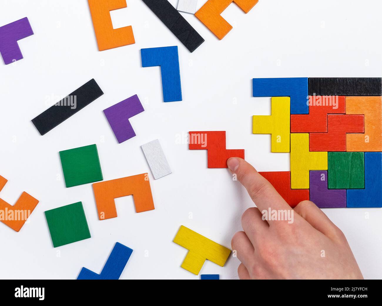 Hand solving puzzle. Logical thinking, strategy, goals achievement ...