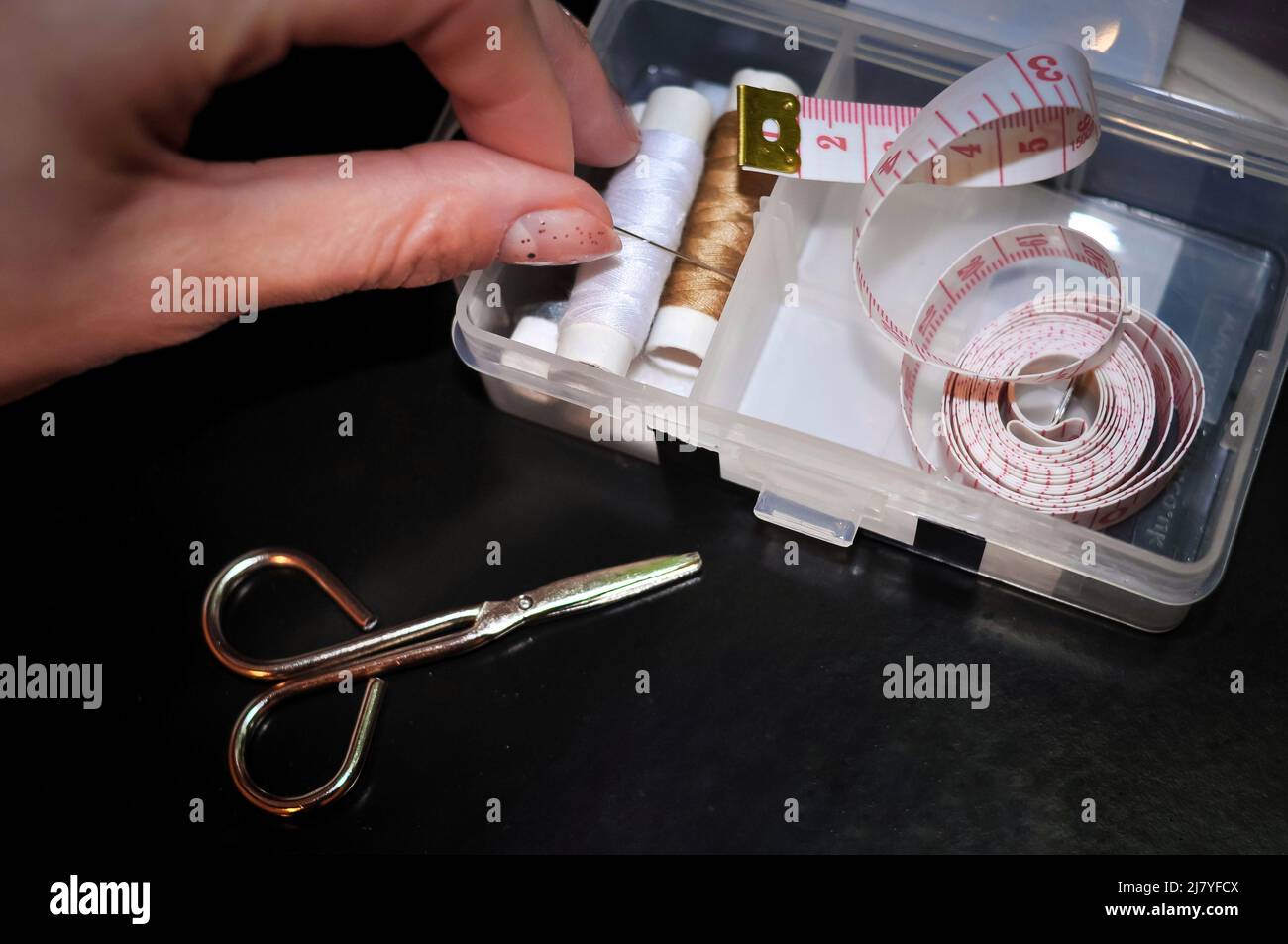 Equipment for sewing scissors tap measure and threads Stock Photo - Alamy