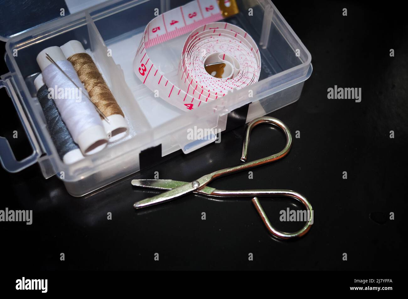 Equipment for sewing scissors tap measure and threads Stock Photo - Alamy
