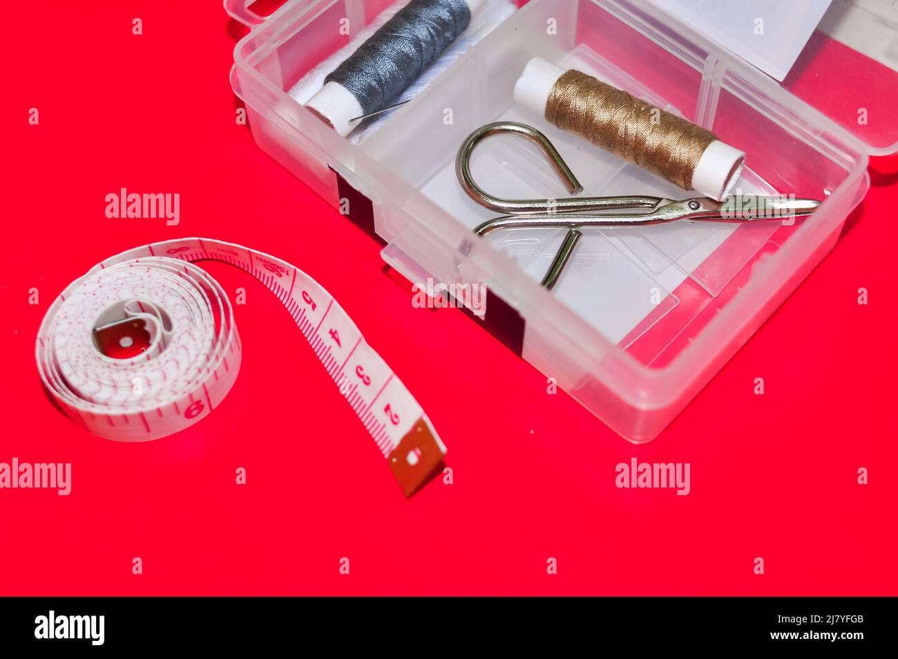 Equipment for sewing scissors tap measure and threads Stock Photo - Alamy