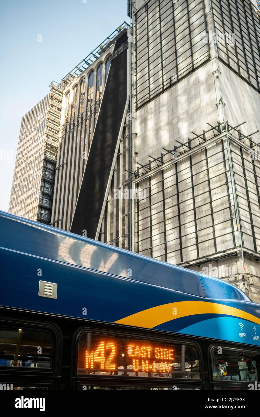 An M42 bus along West 42nd Street passes the One Times Square tower ...
