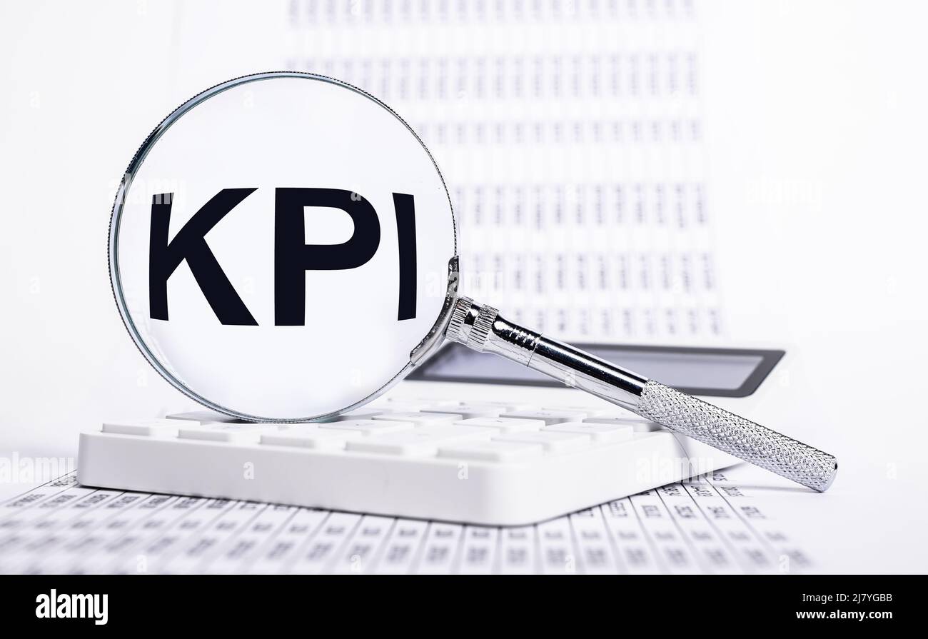 Key performance indicators. Magnifier with KPI letters, statistics ...