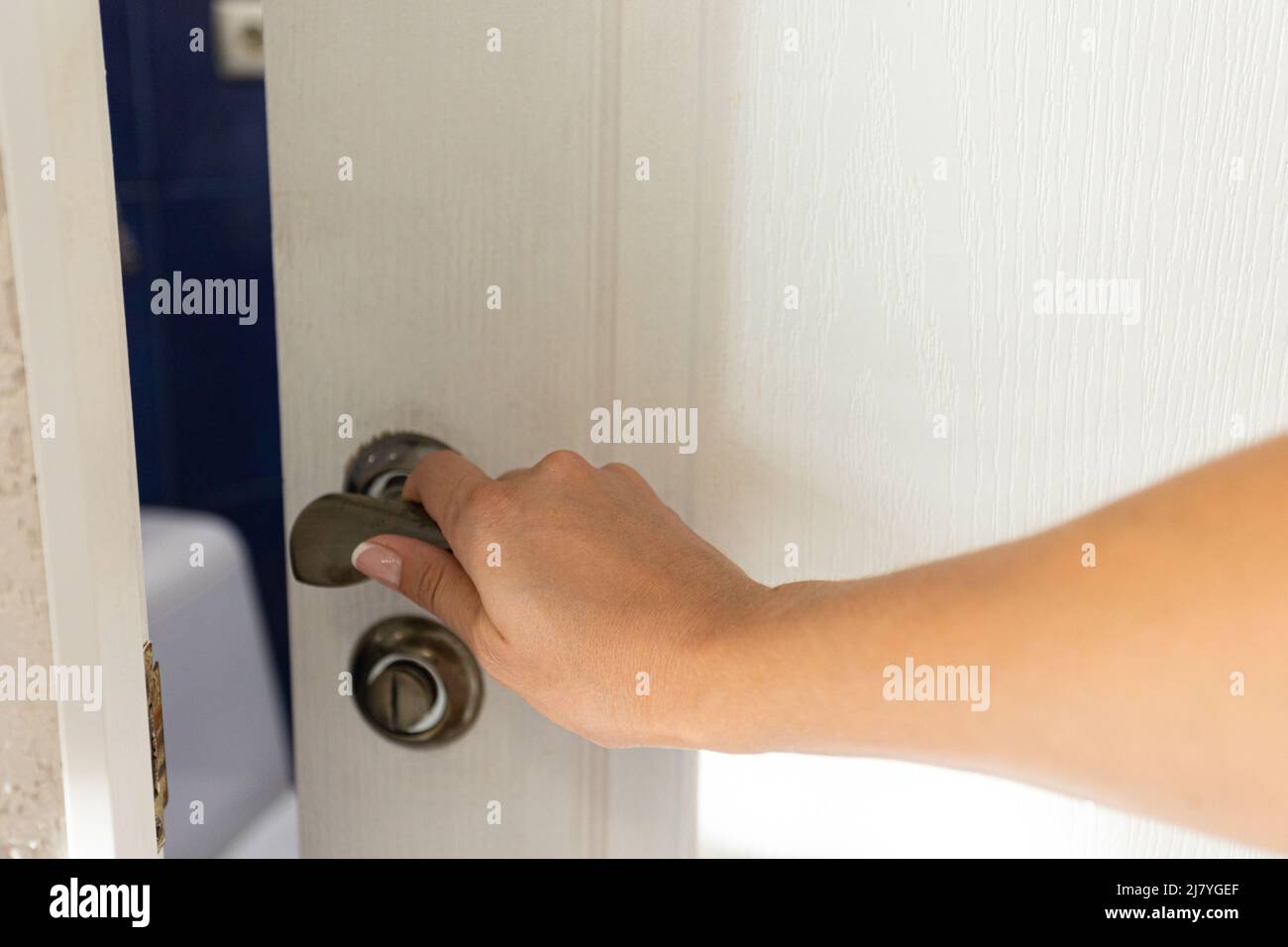 Hand opens door handle hi-res stock photography and images - Alamy
